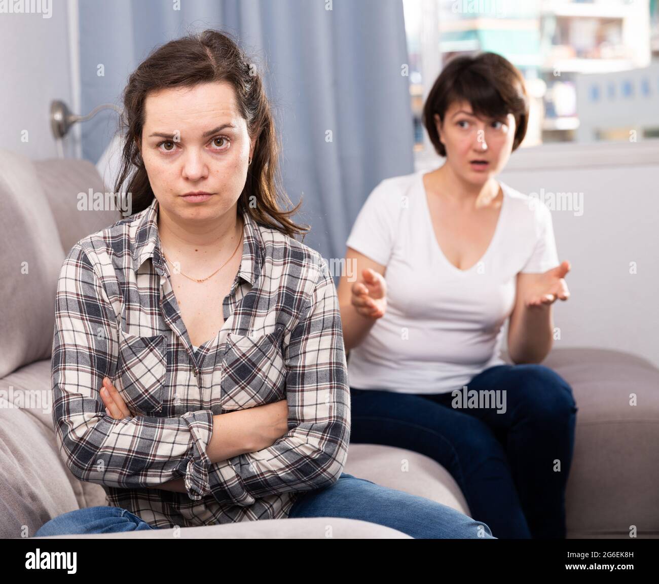 Home quarrel between friends woman Stock Photo - Alamy