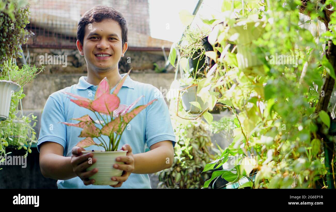 Portrait young asian male gardener hi-res stock photography and images ...
