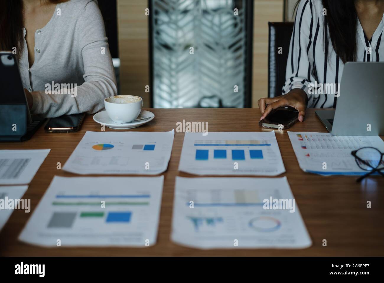 Marketing plan researching. Paperwork on the paperwork on wooden desk ...