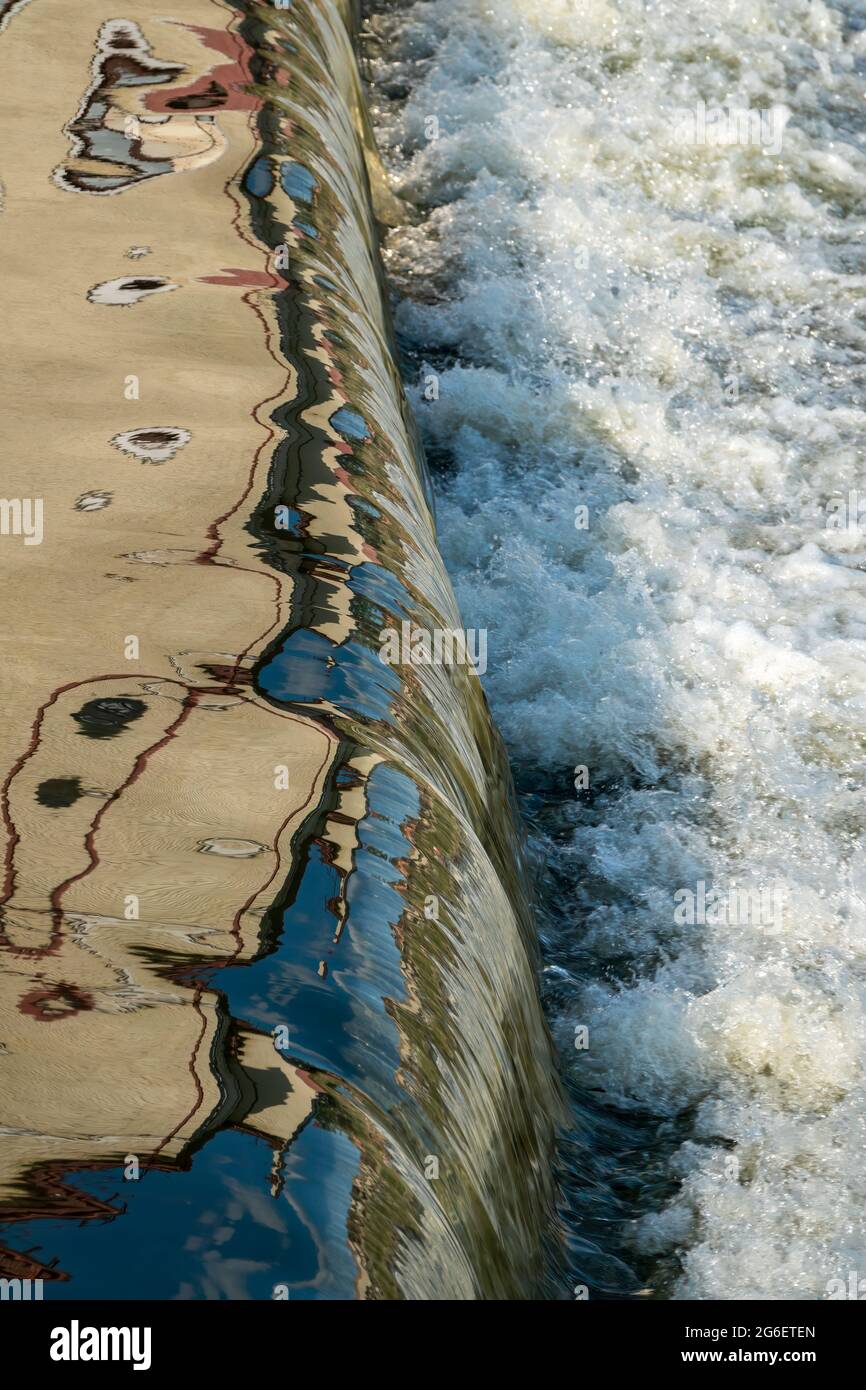 A small flat cascade in a calm river. Water background Stock Photo - Alamy