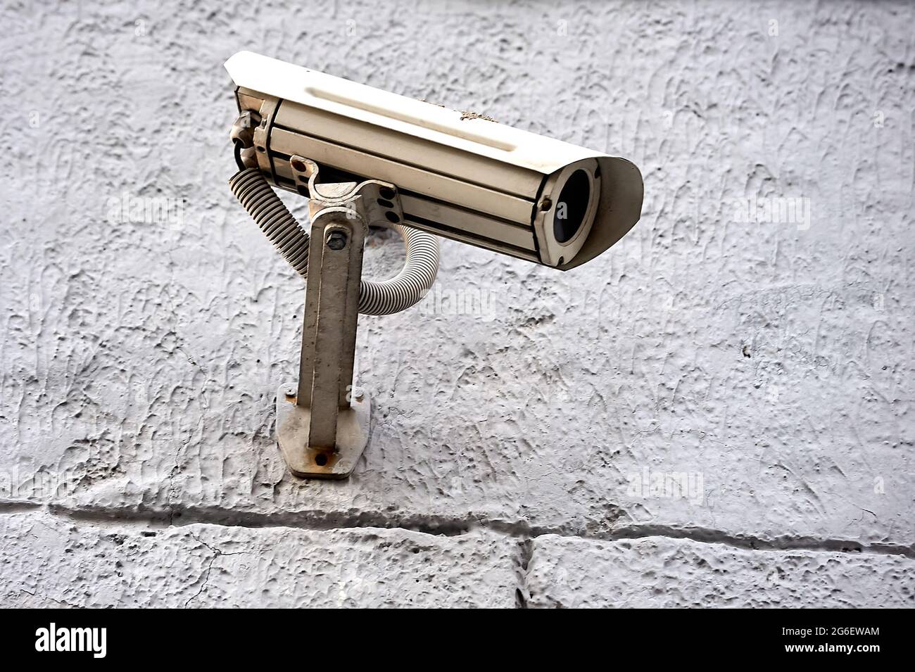 Surveillance camera hanging on the wall hi-res stock photography and ...