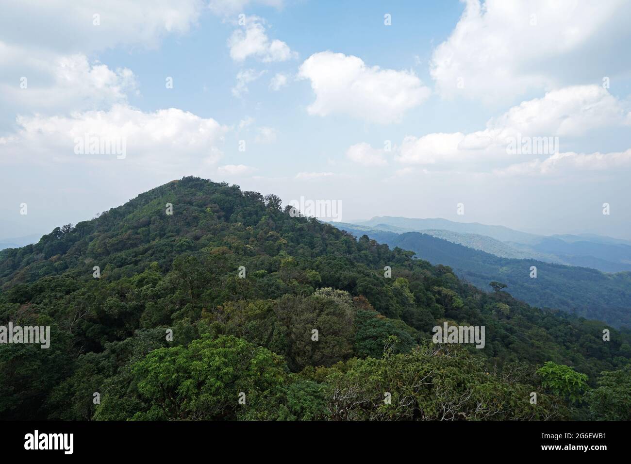 Natural landscape of grassy pathway to the mountain peak with cloudy ...