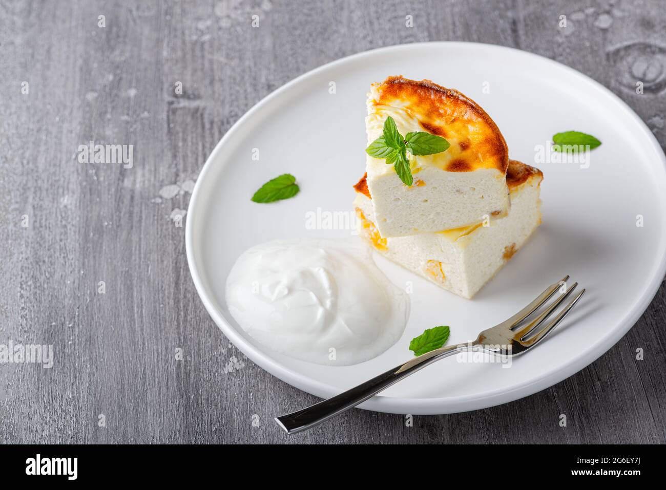 Cottage cheese casserole with raisins and semolina on wooden grey ...