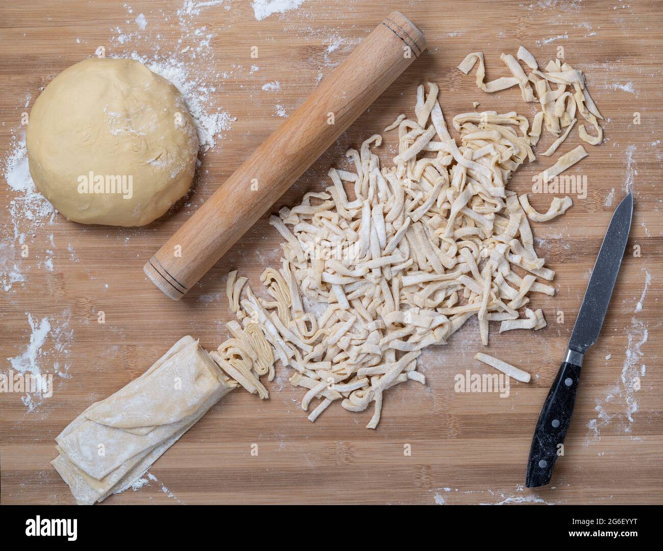 Making homemade noodles at home in the kitchen from scratch by hand ...