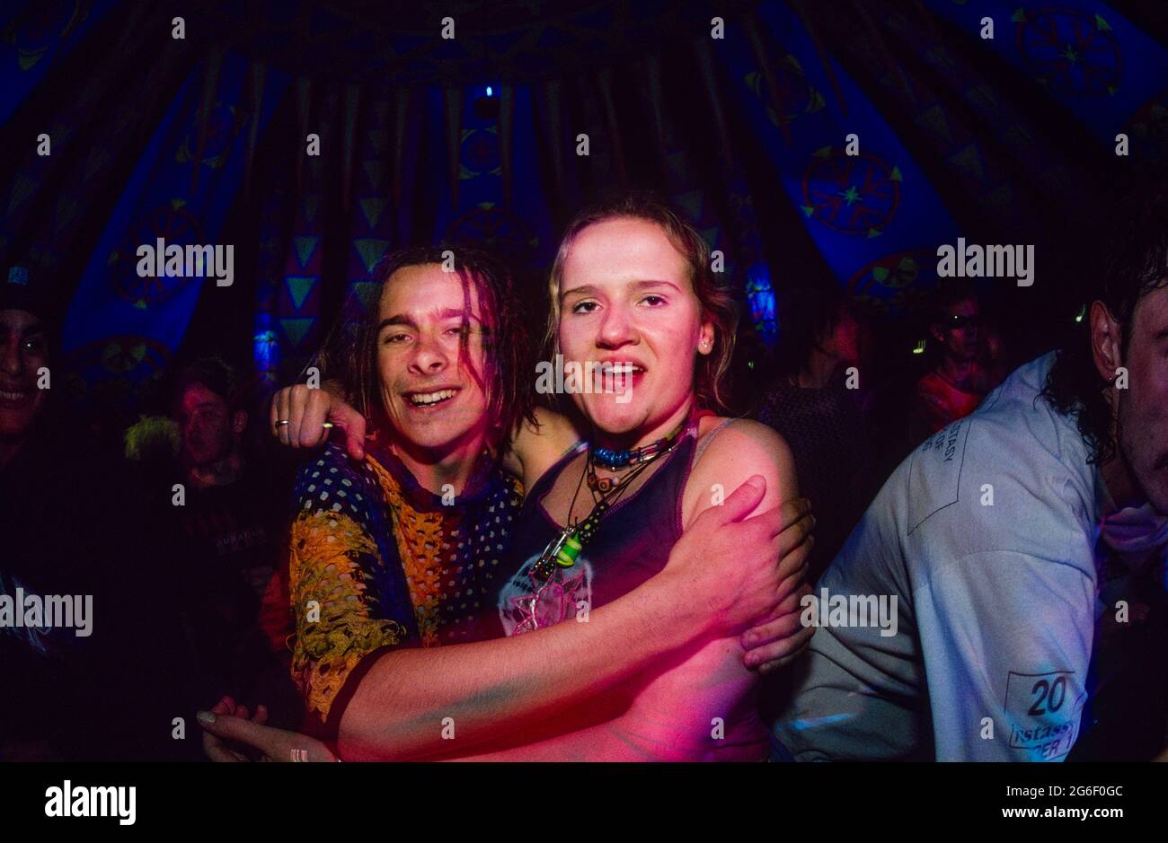 A man and woman hugging at, Tribal Gathering an all night rave held in ...