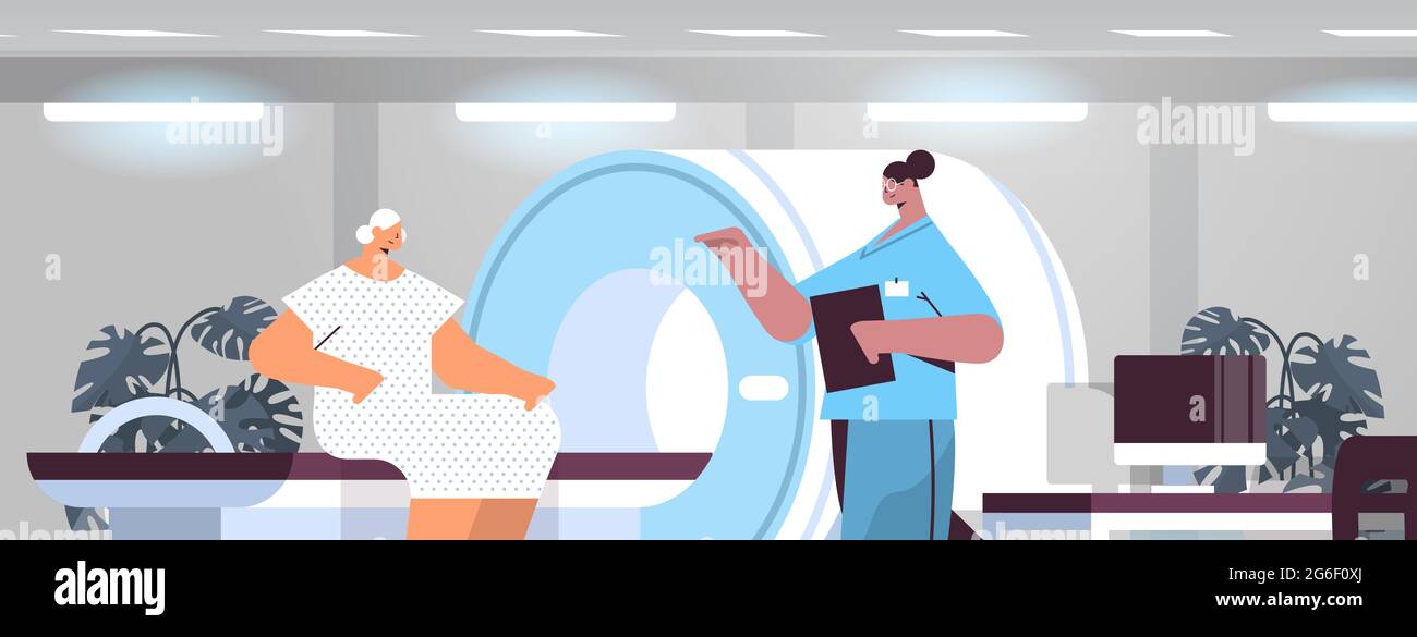 doctor with senior patient in tomography machine magnetic resonance ...
