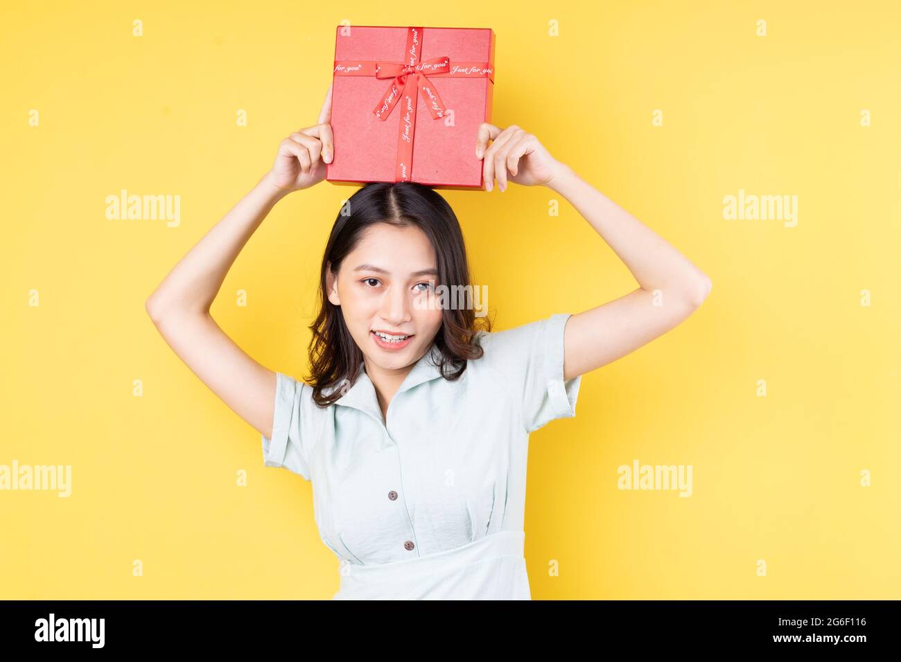 Asian person giving gift hi-res stock photography and images - Alamy