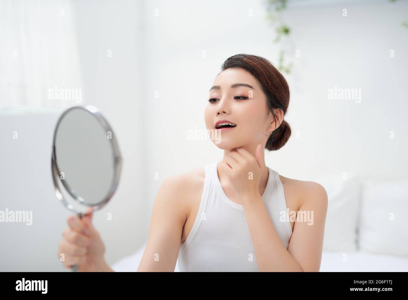 Beautiful face of young adult woman with clean fresh skin Stock Photo ...