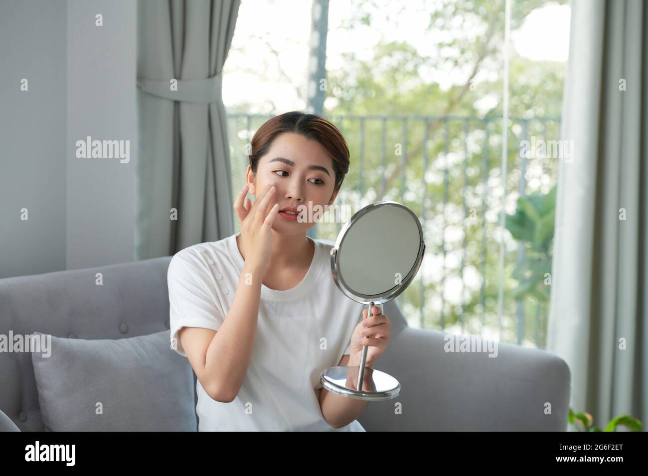 beauty image, Asian woman being concerned with the mirror Stock Photo ...