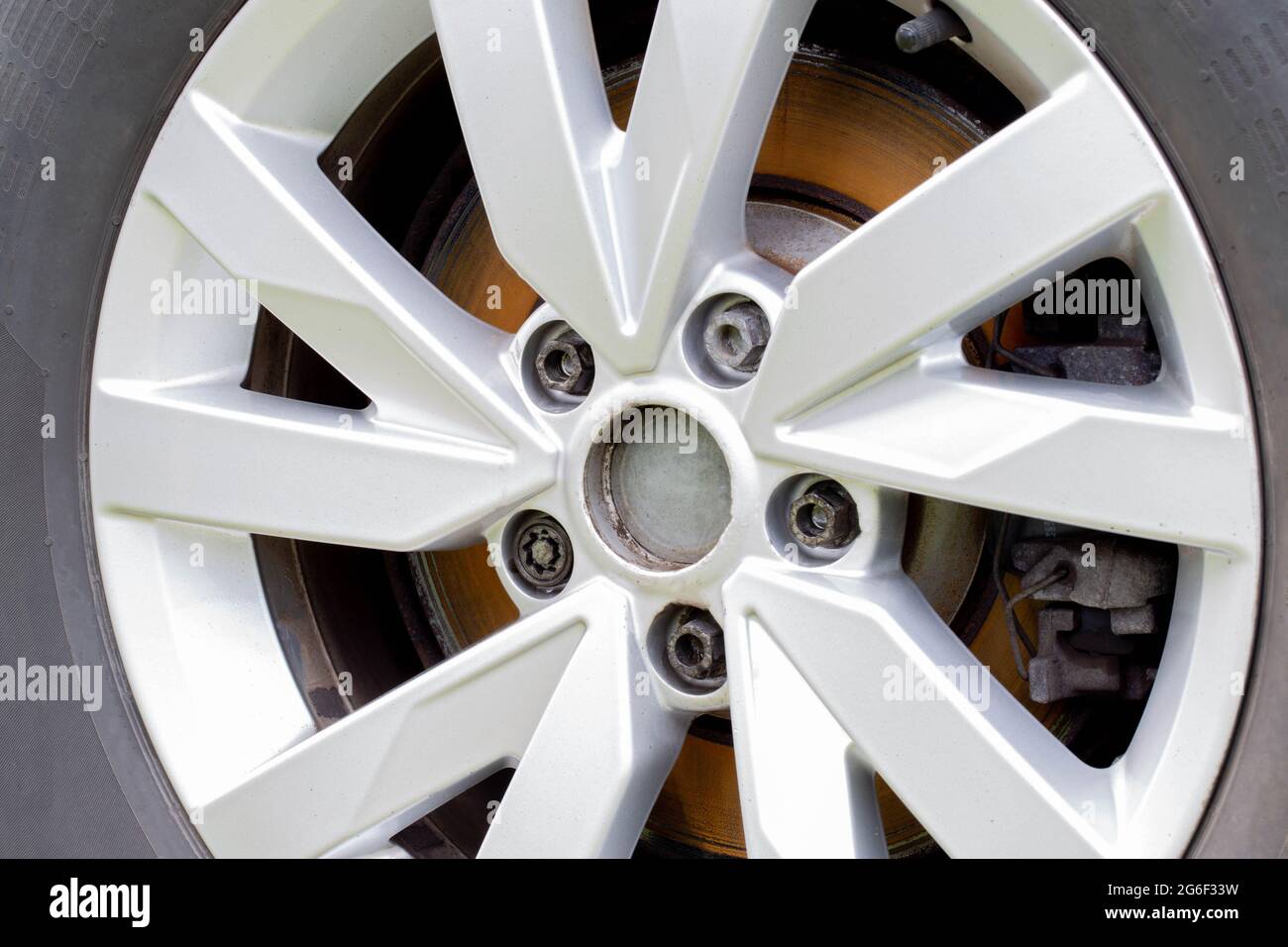 Rusty, defective brake disc with a shoulder on the edge. Worn brake ...