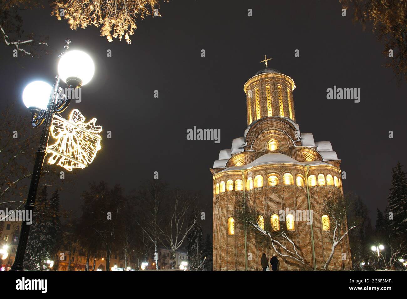 Church in the winter. Night city Stock Photo - Alamy