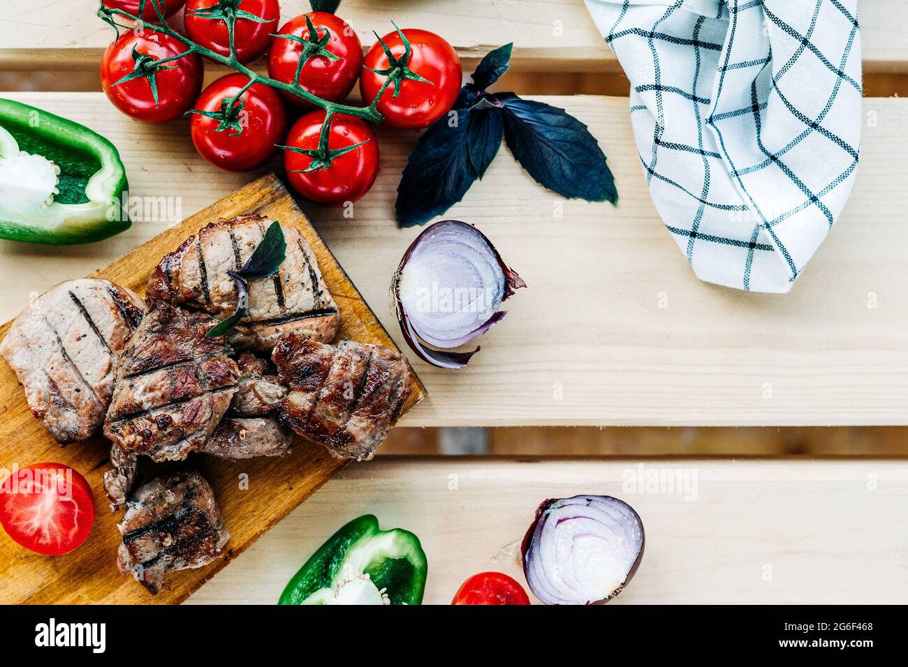 Top view Barbecue with meat, vegetable, tomato, pepper, onion, basil ...