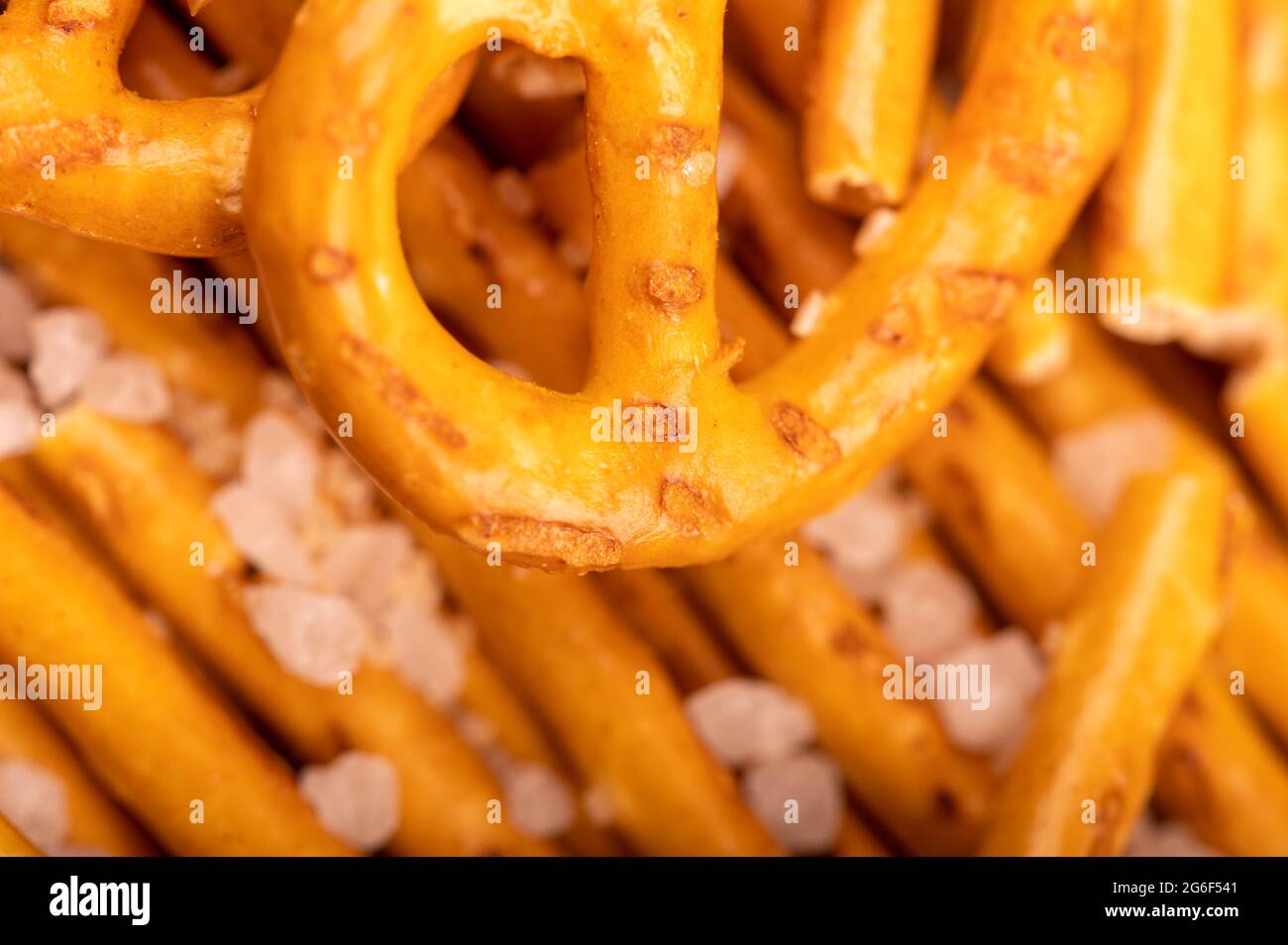 Bread sticks and bread figures with salt. Close-up Background image ...
