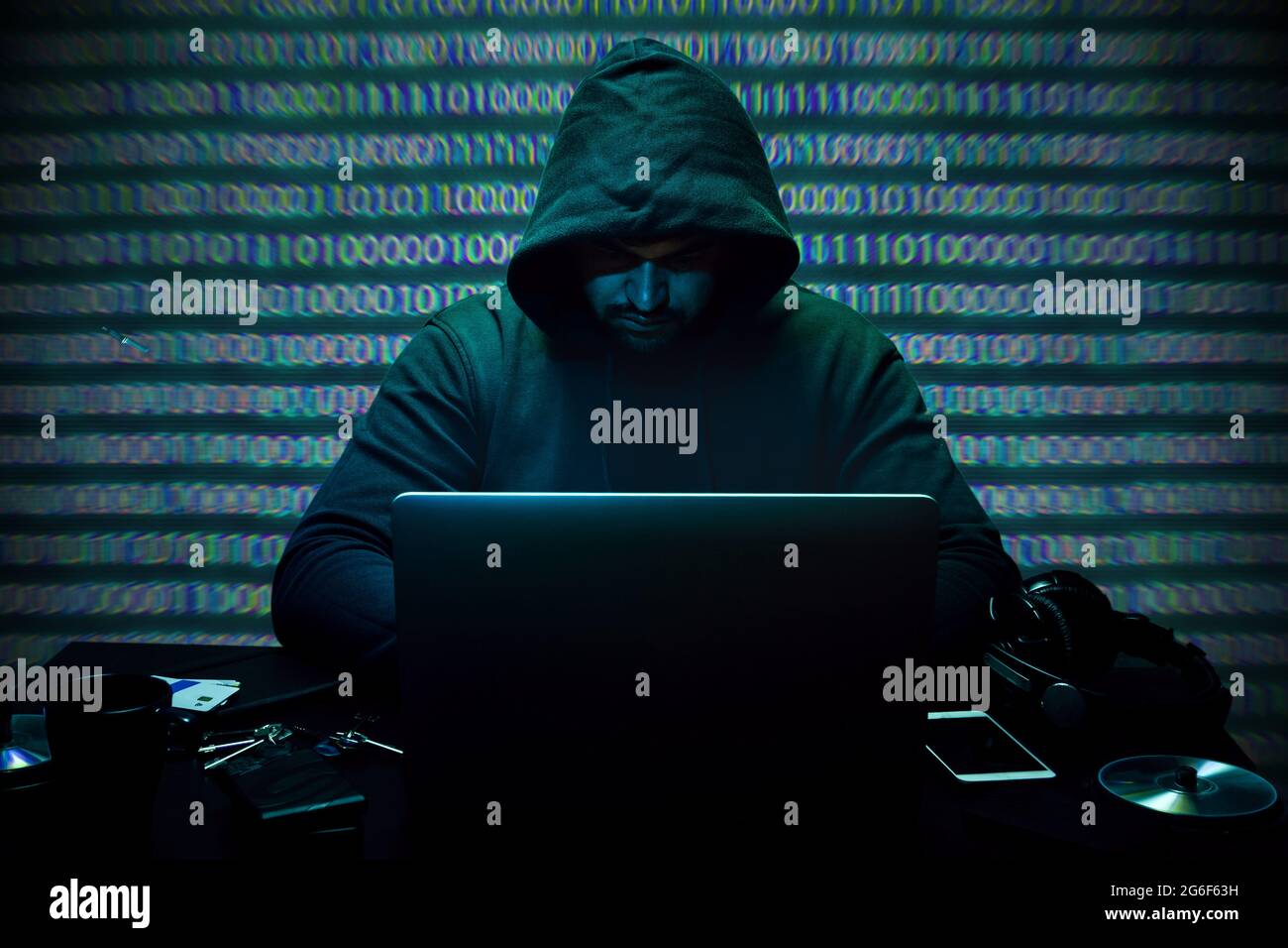Hacker programmer using computer in dark room Stock Photo - Alamy