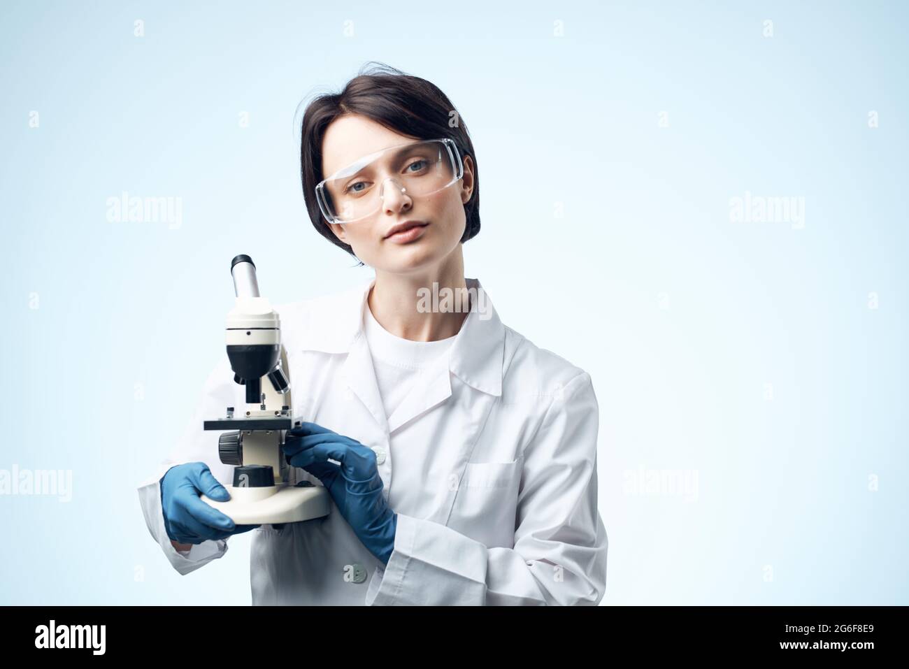 female laboratory assistant medicine research biotechnology microscope ...