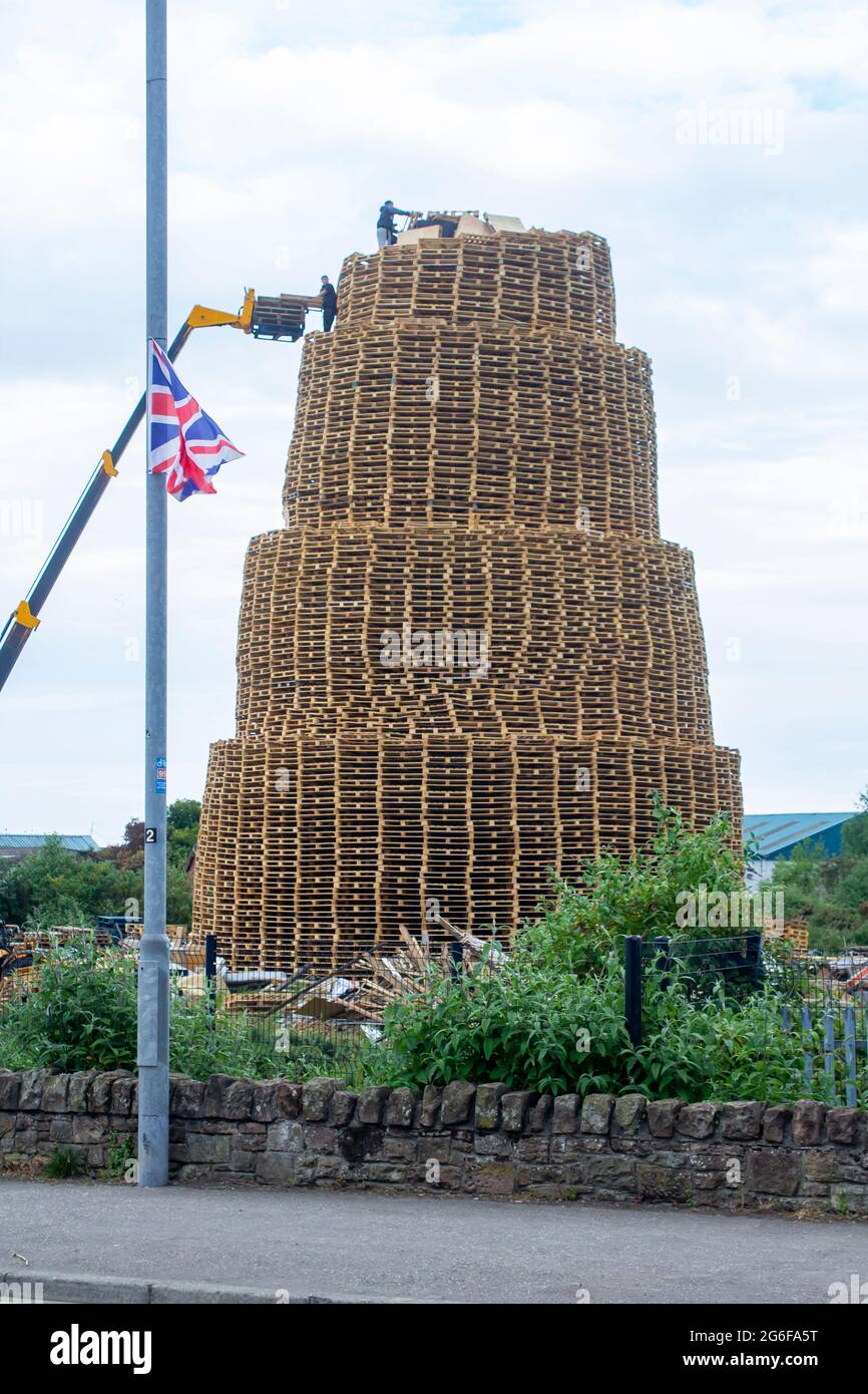 4 July 2021 Youths on top of the very tall bonfire made from thousands ...