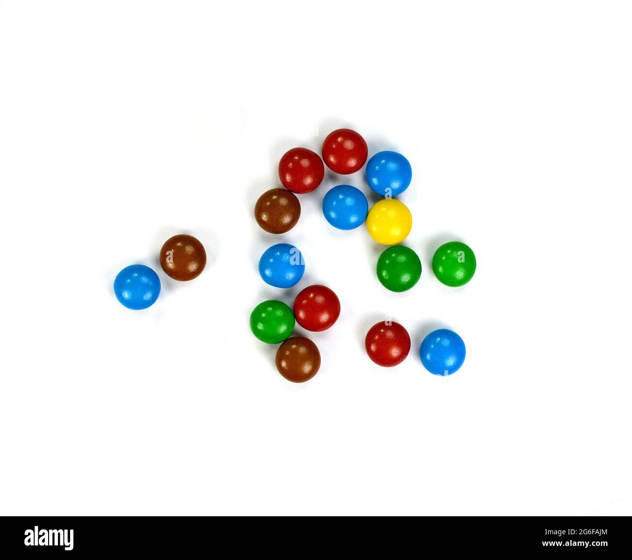 Round candies on a white background, scattered candies. Colorful round ...