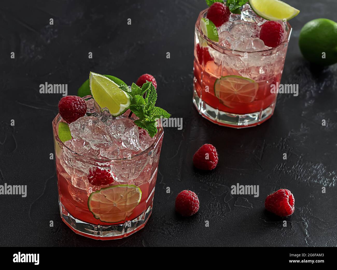 Bourbon or rum raspberry smash cocktail with lime and mint. Refreshing ...