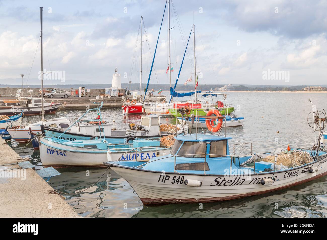 Fishing boats and lighthouse hi-res stock photography and images - Alamy