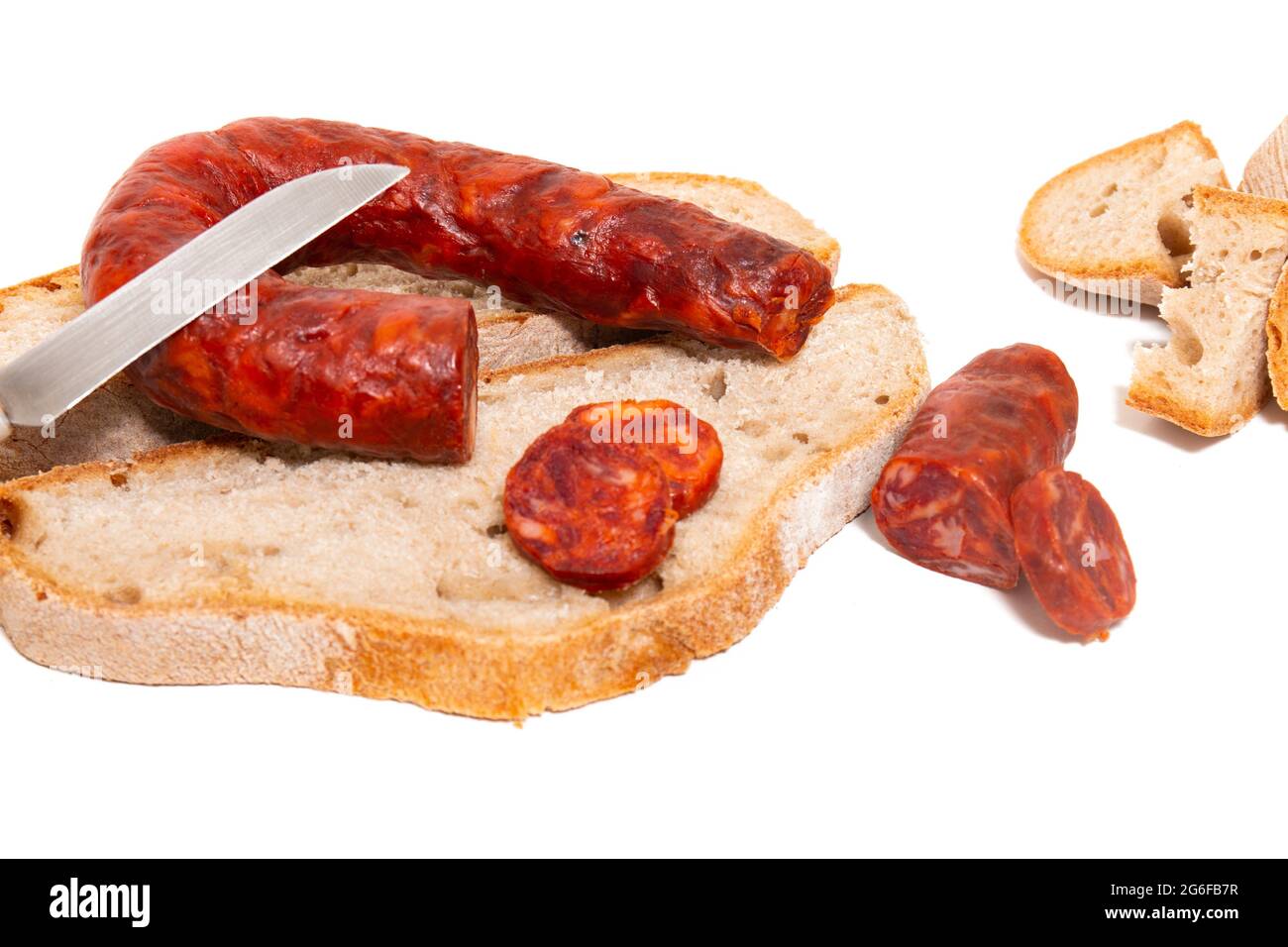 chorizo and traditional bread slices isolated on a white background ...