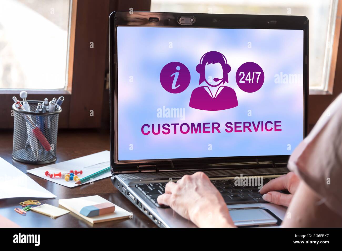 Laptop screen displaying a customer service concept Stock Photo - Alamy