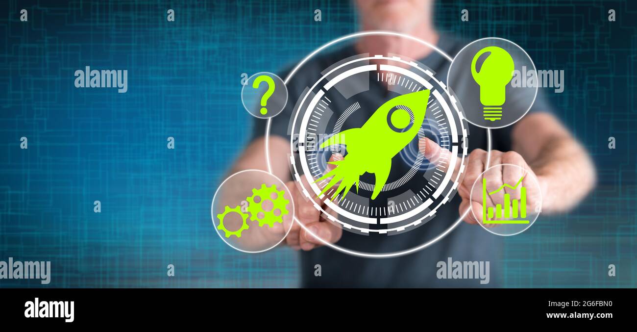 Man touching a start up concept on a touch screen with his fingers ...