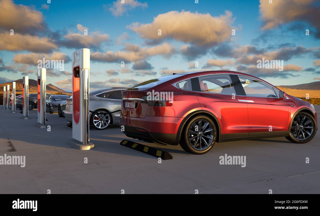 Tesla electric cars at a fast charging station Stock Photo - Alamy