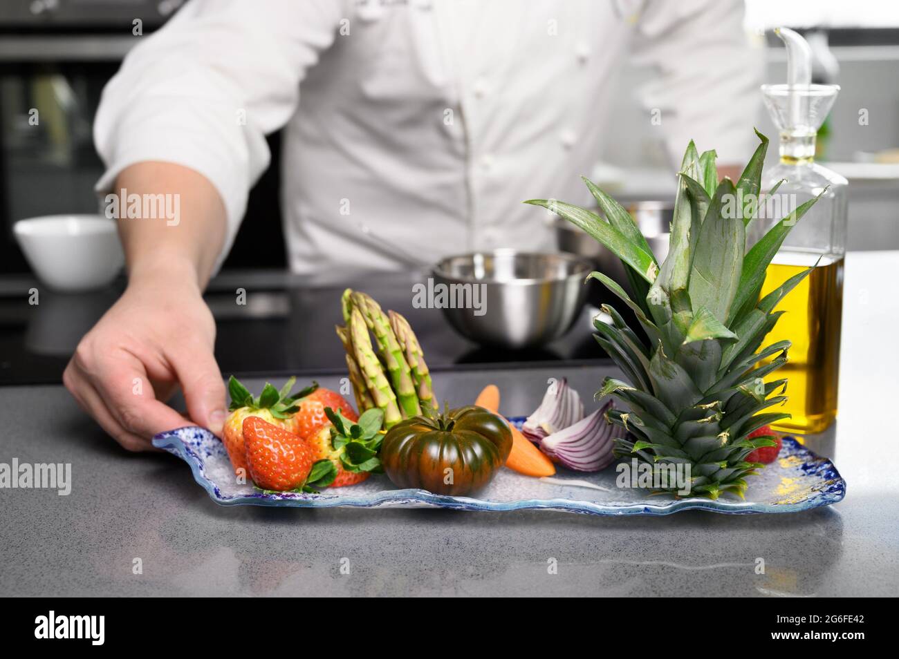 Chef hand holding vegetables hi-res stock photography and images - Alamy