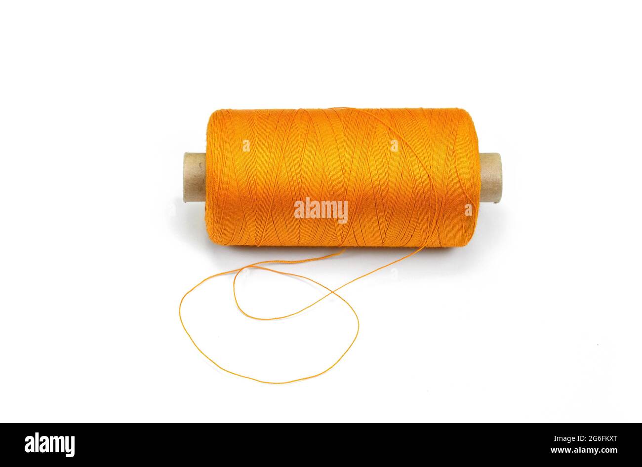 Color sewing threads isolated on white background Stock Photo - Alamy