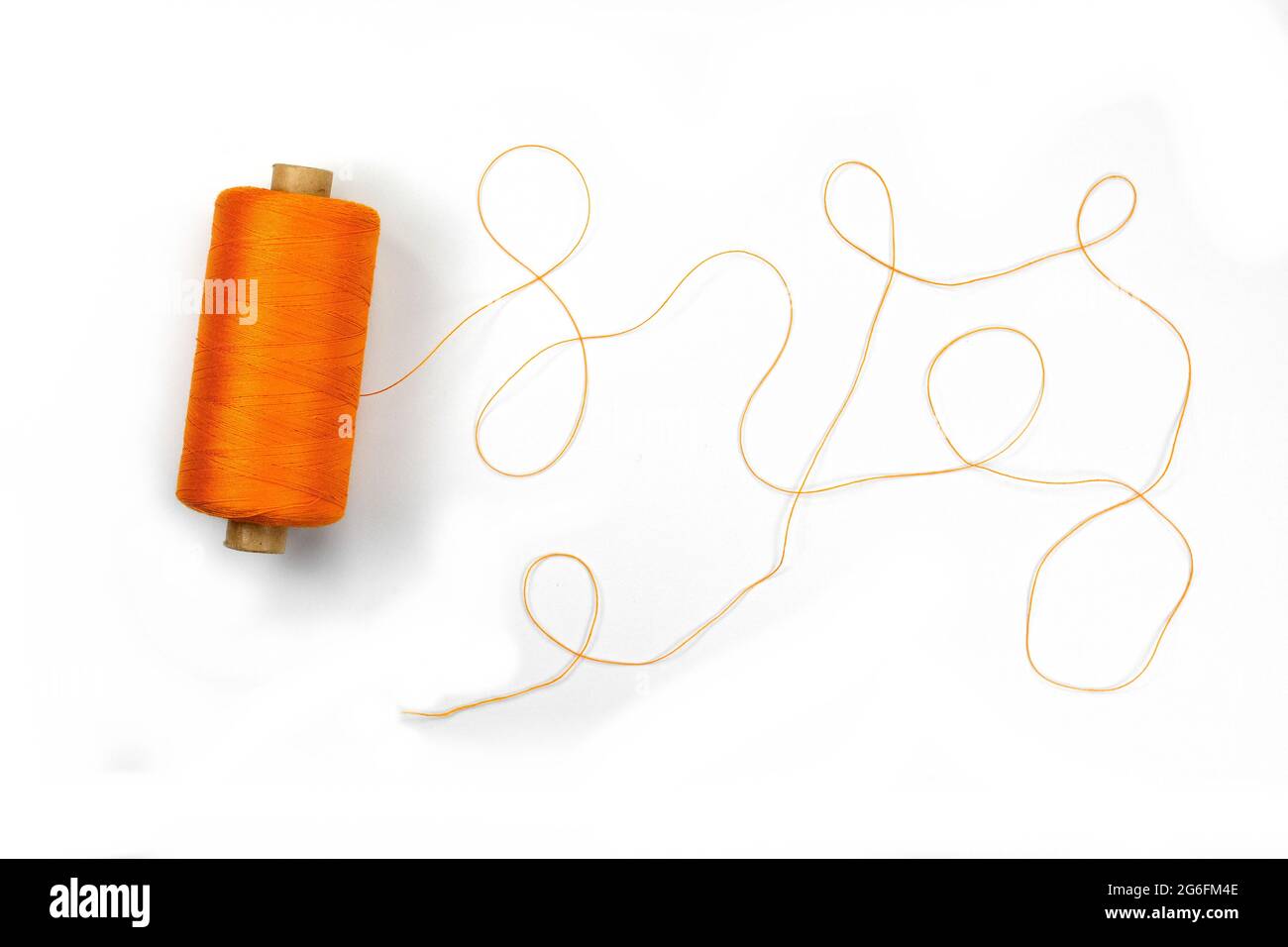 Color sewing threads isolated on white background Stock Photo - Alamy