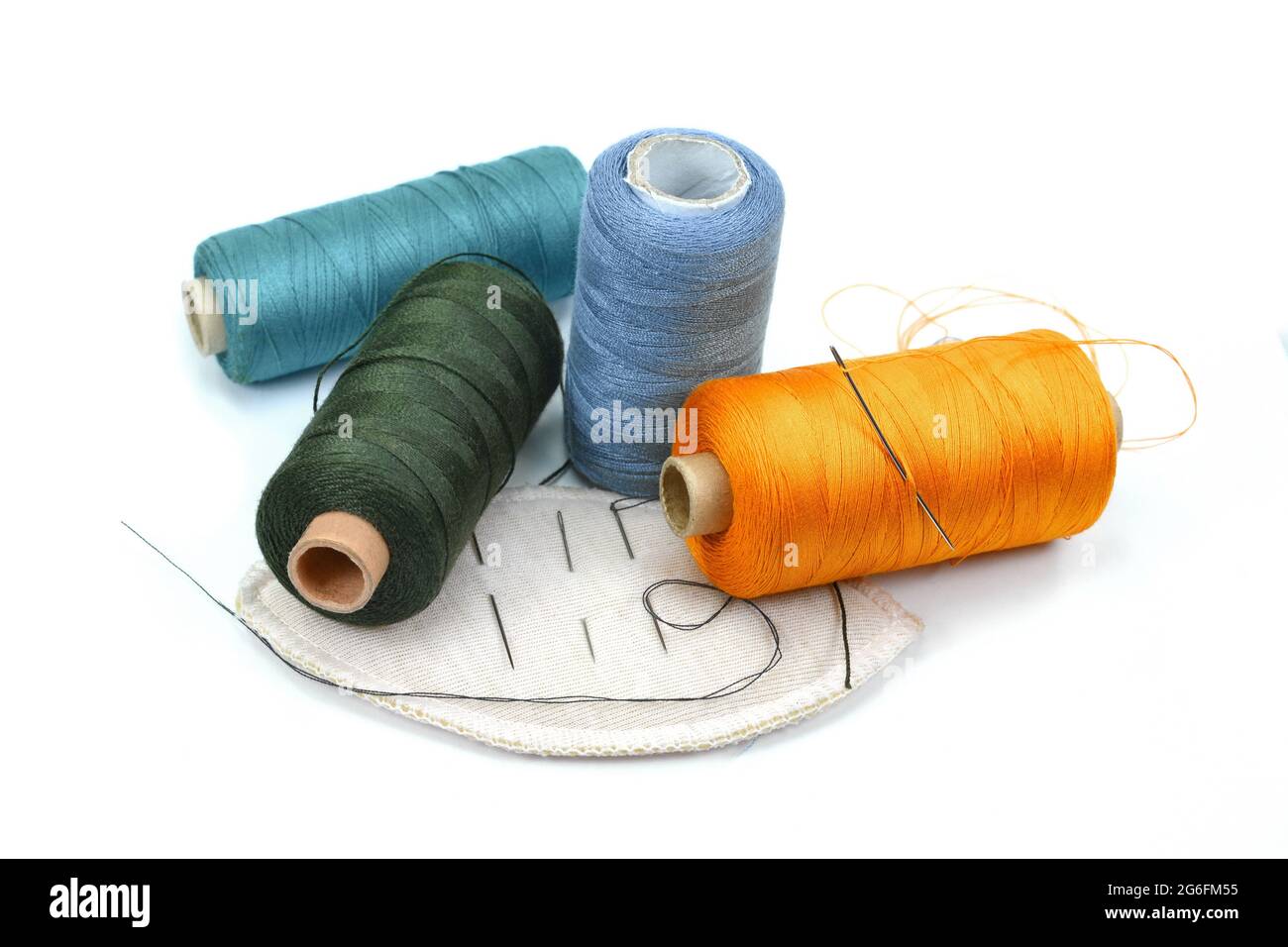 Color sewing threads isolated on white background Stock Photo - Alamy
