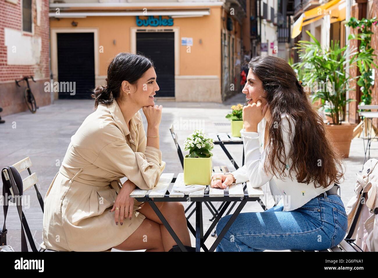 Two young girls enjoying a morning of shopping Stock Photo - Alamy