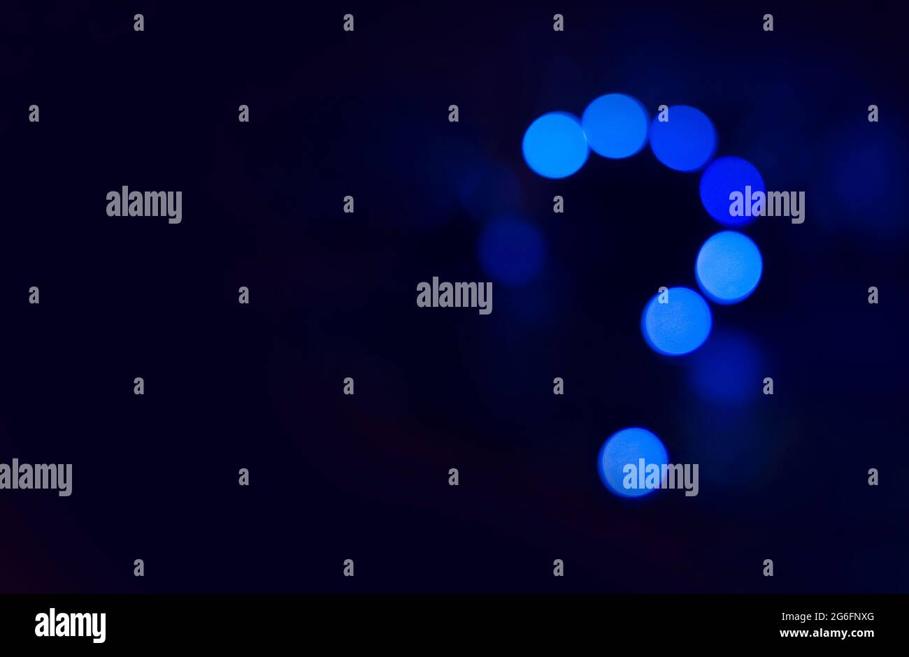 Question mark in blue abstract light background. Neon light night ...