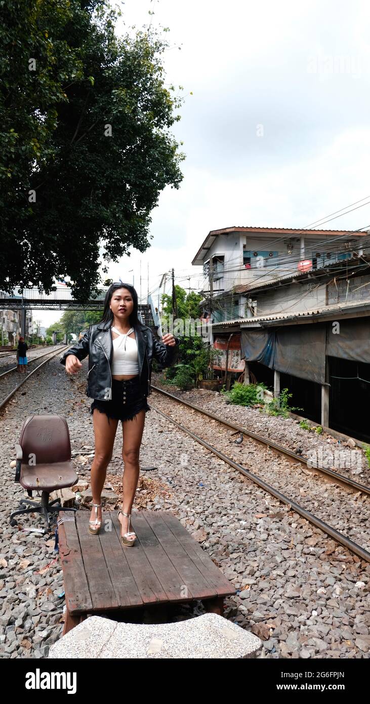 1950's Style Railroad with Chinese Asian Female Fashion Model Standing ...