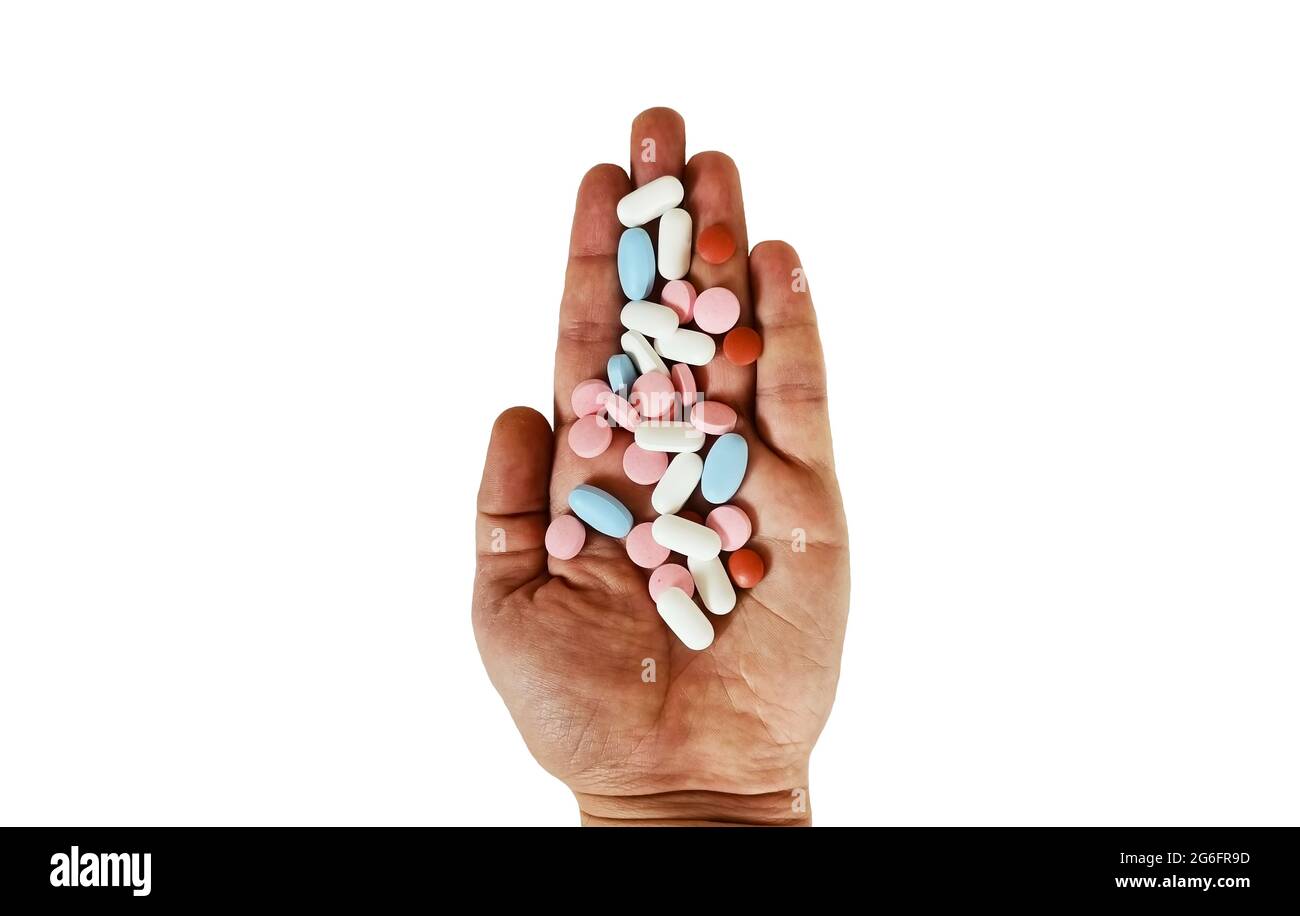 Medical colorful drugs. Hand holding medicine Stock Photo - Alamy