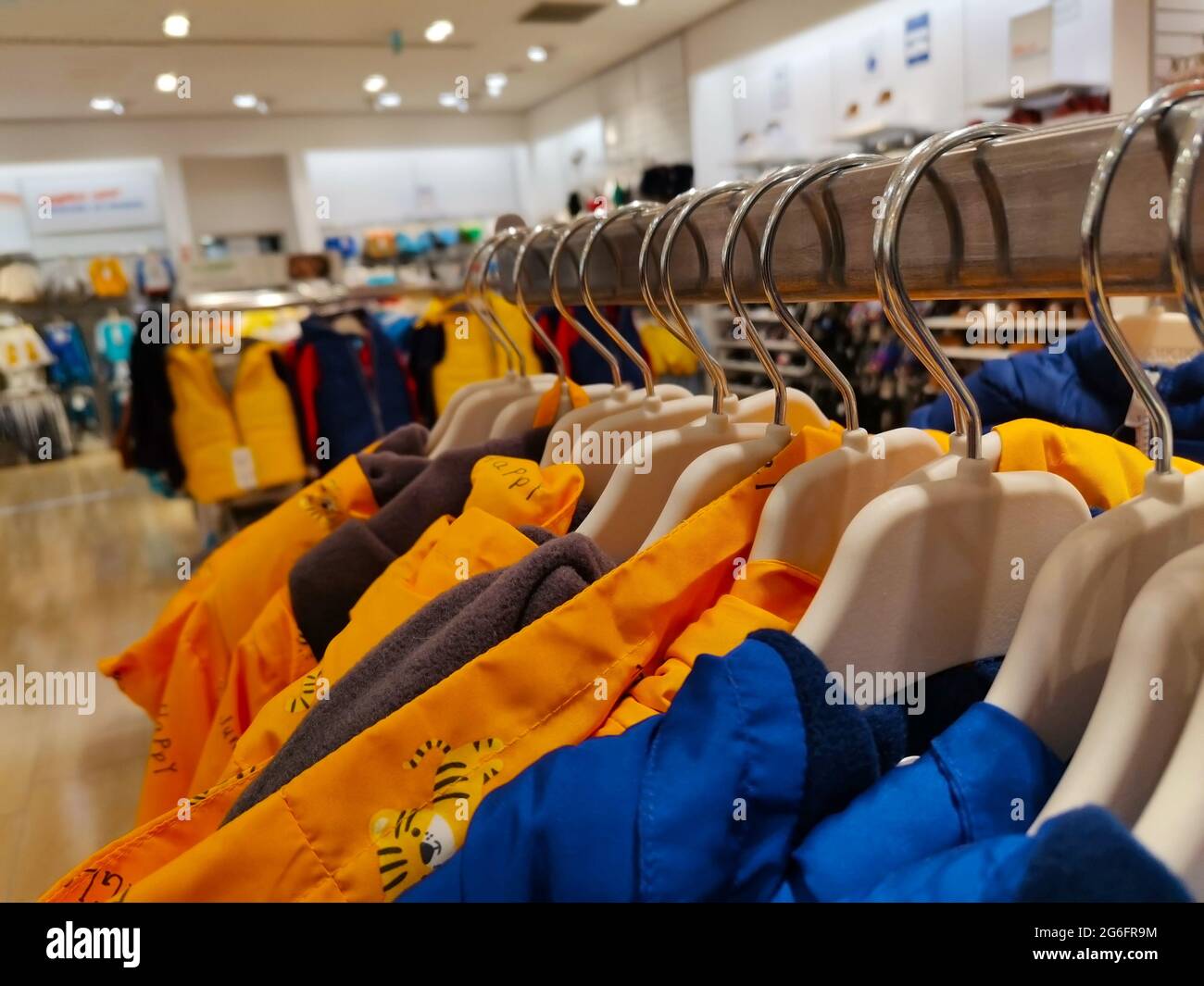 Boutique. The clothes in the aisle Stock Photo - Alamy