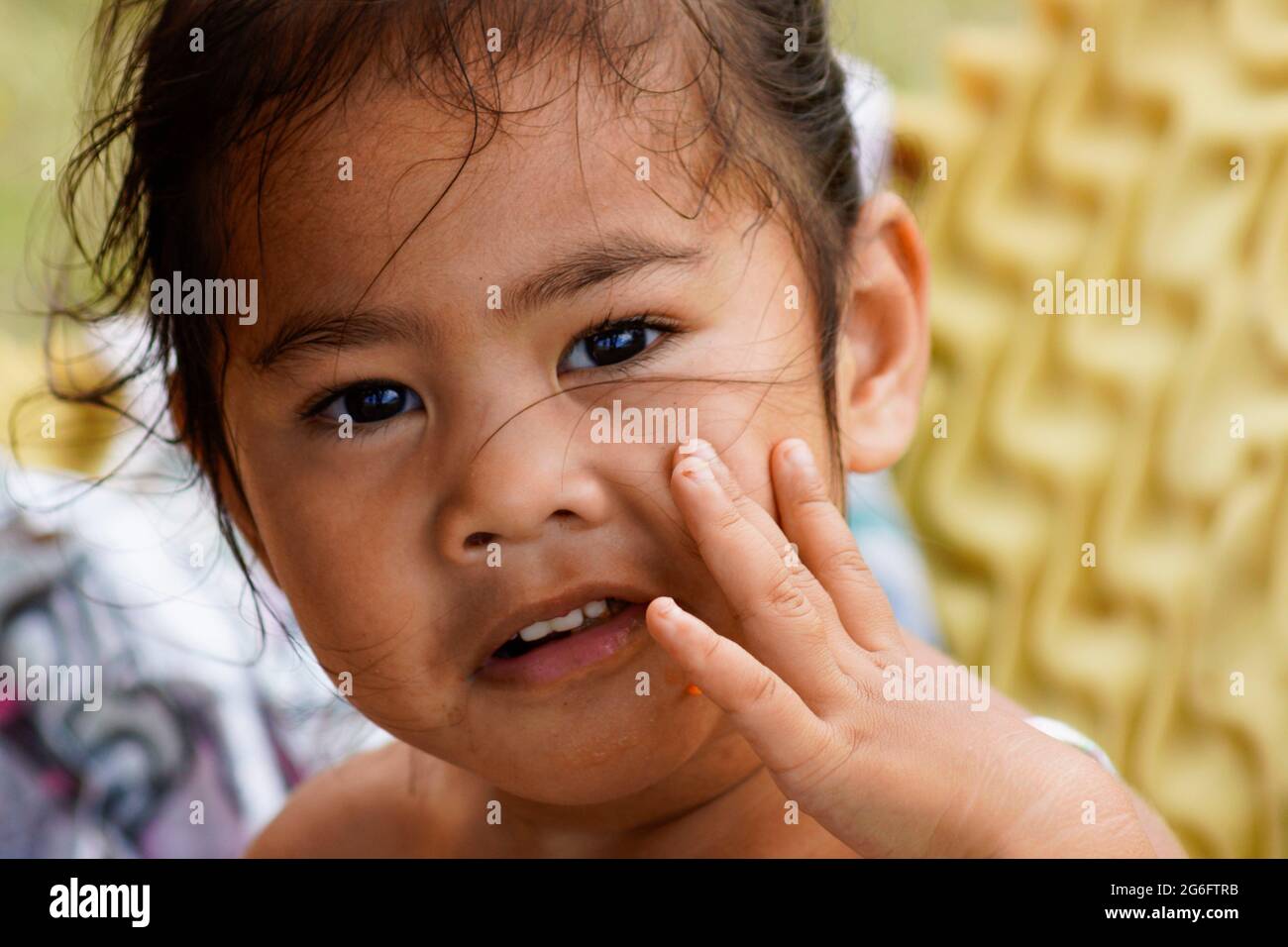 Adorable child posing for portrait at the Temehea Site, Taiohae ...