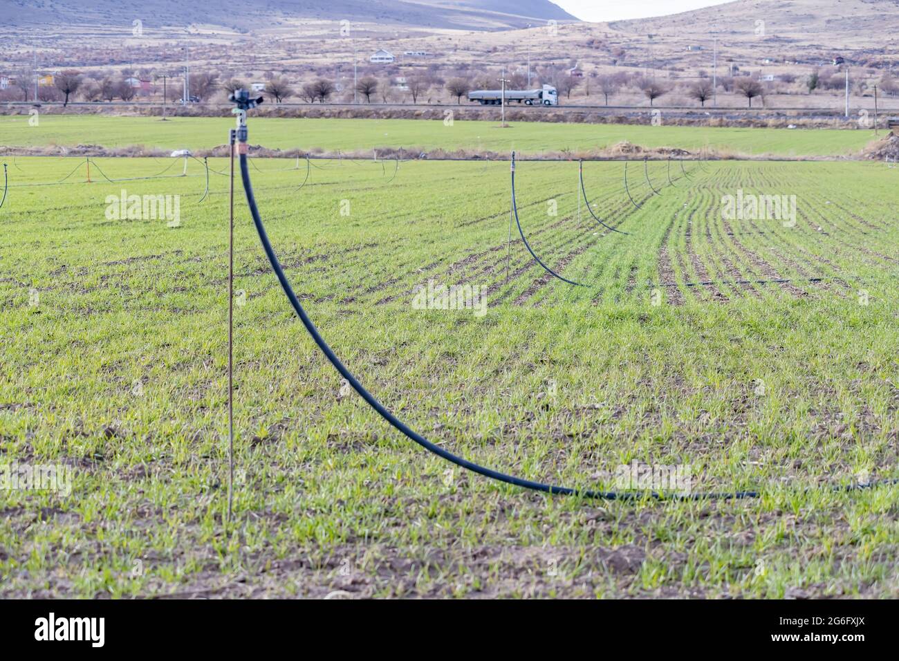 Watering smart system in a green field Stock Photo - Alamy
