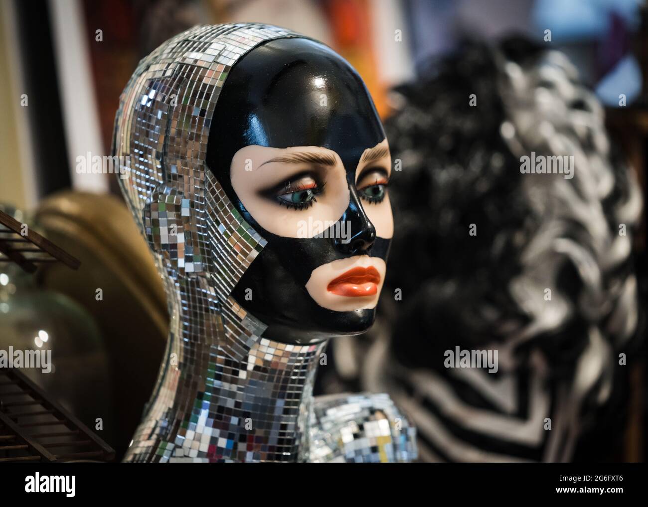 Strange sparkling mannequin head with mirrored glass pieces wearing ...