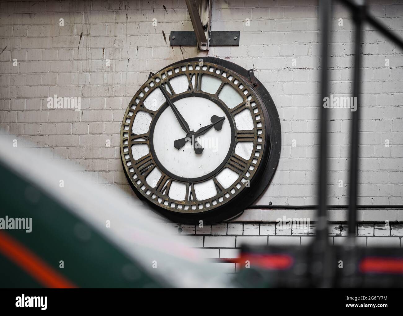 Old fashioned vintage big industry factory clock hanging with roman ...