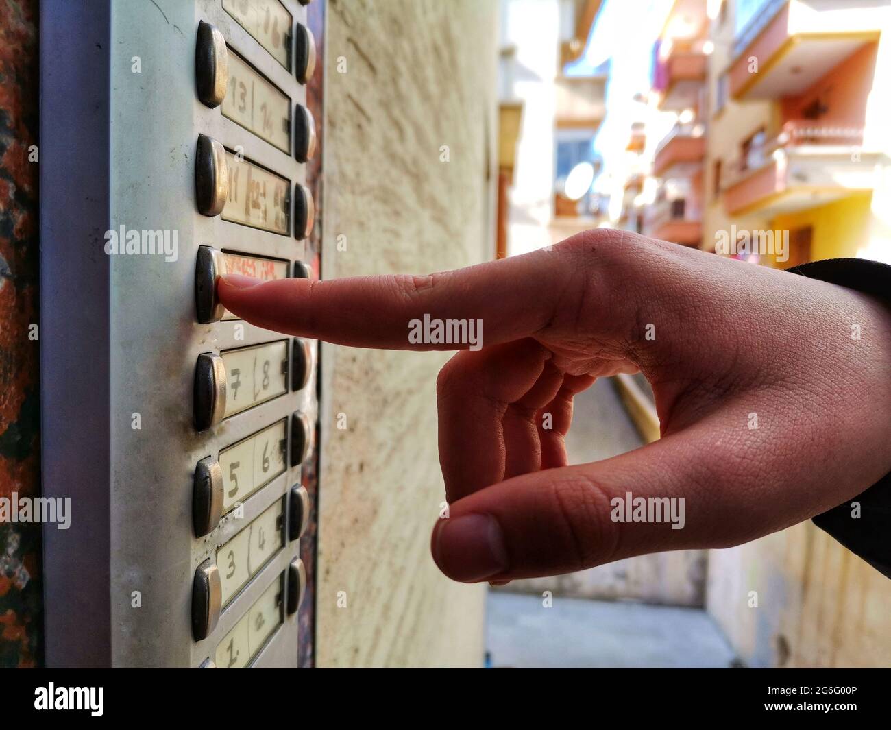 The hand pressing the doorbell Stock Photo - Alamy