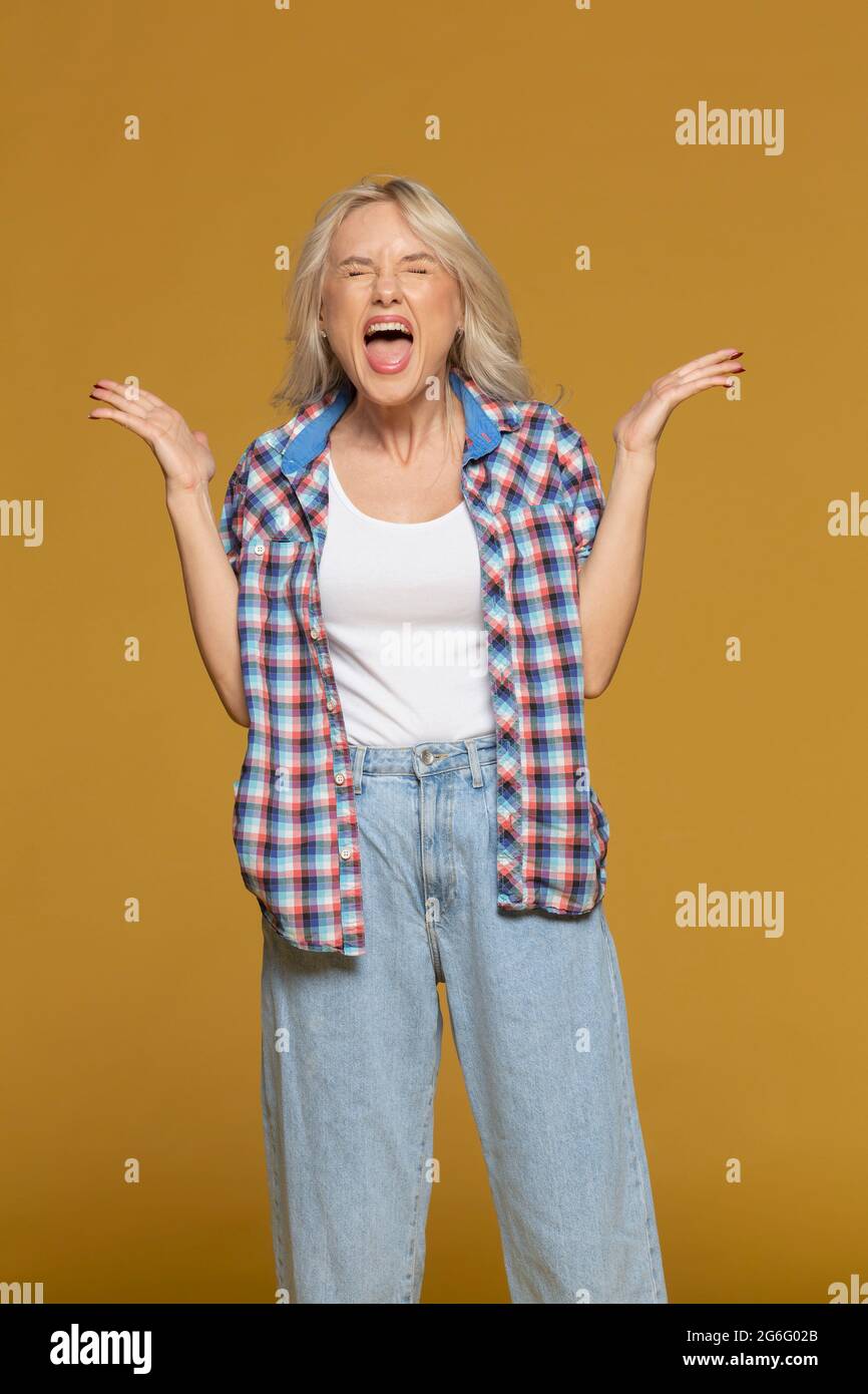 Angry mid adult woman studio hi-res stock photography and images - Alamy