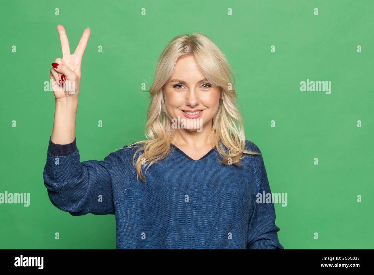 Gesturing peace sign hi-res stock photography and images - Alamy