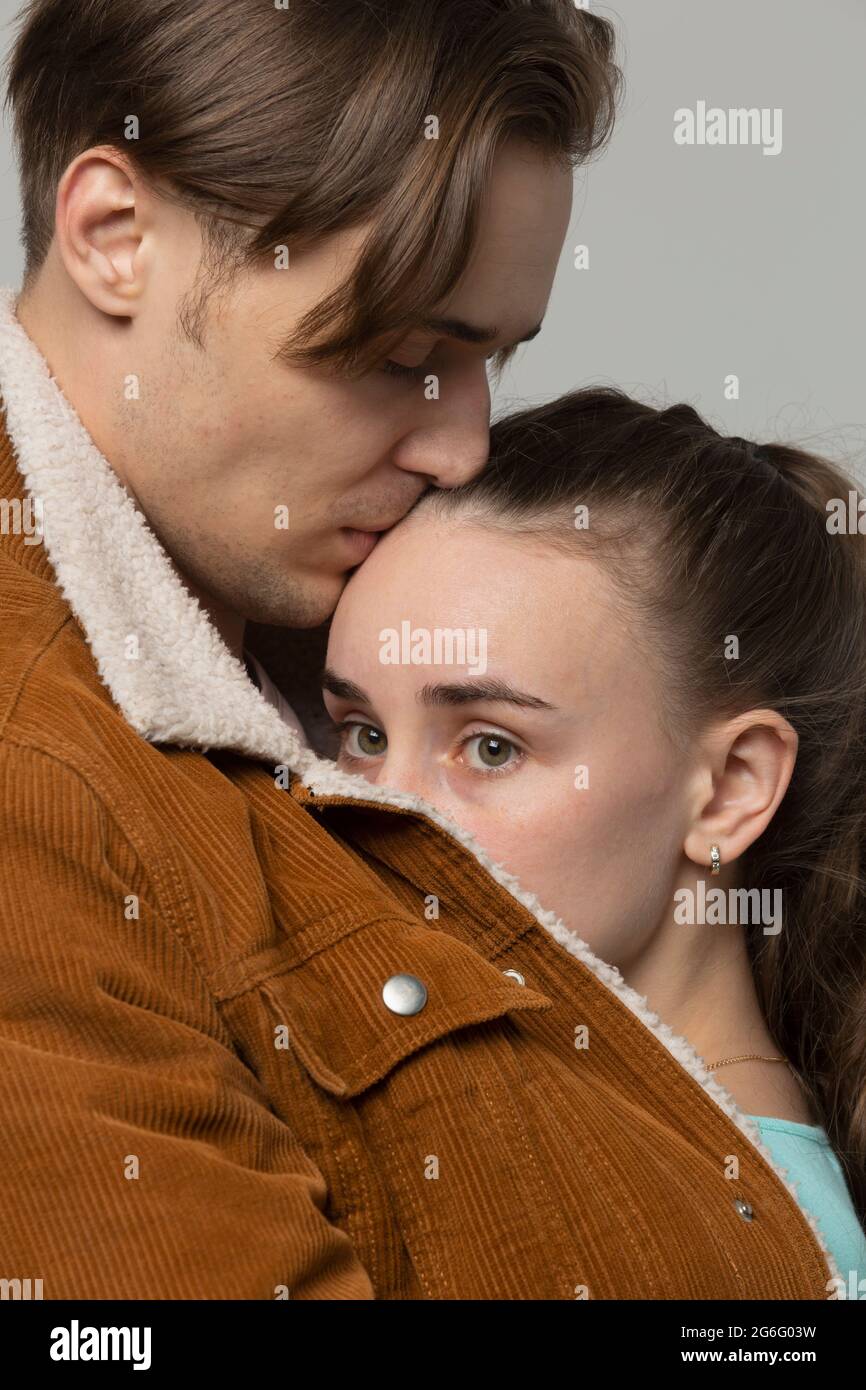 Close up boyfriend comforting worried girlfriend Stock Photo - Alamy