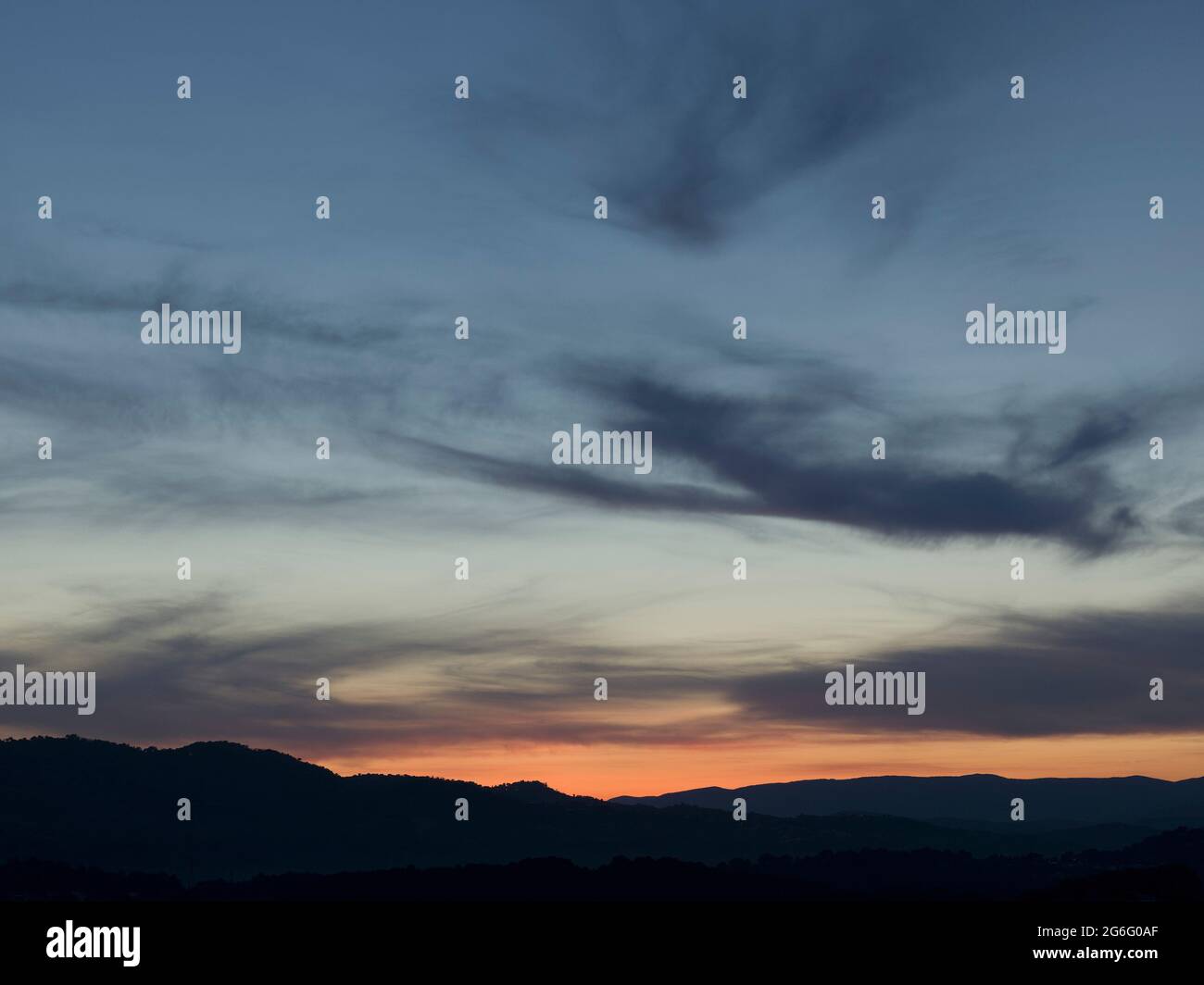 Cloud swirls in blue dusk sky, French Riviera, France Stock Photo - Alamy
