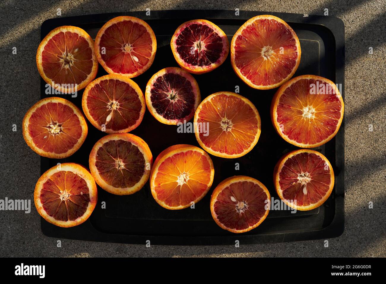 Blood and navel orange cross sections on tray Stock Photo - Alamy