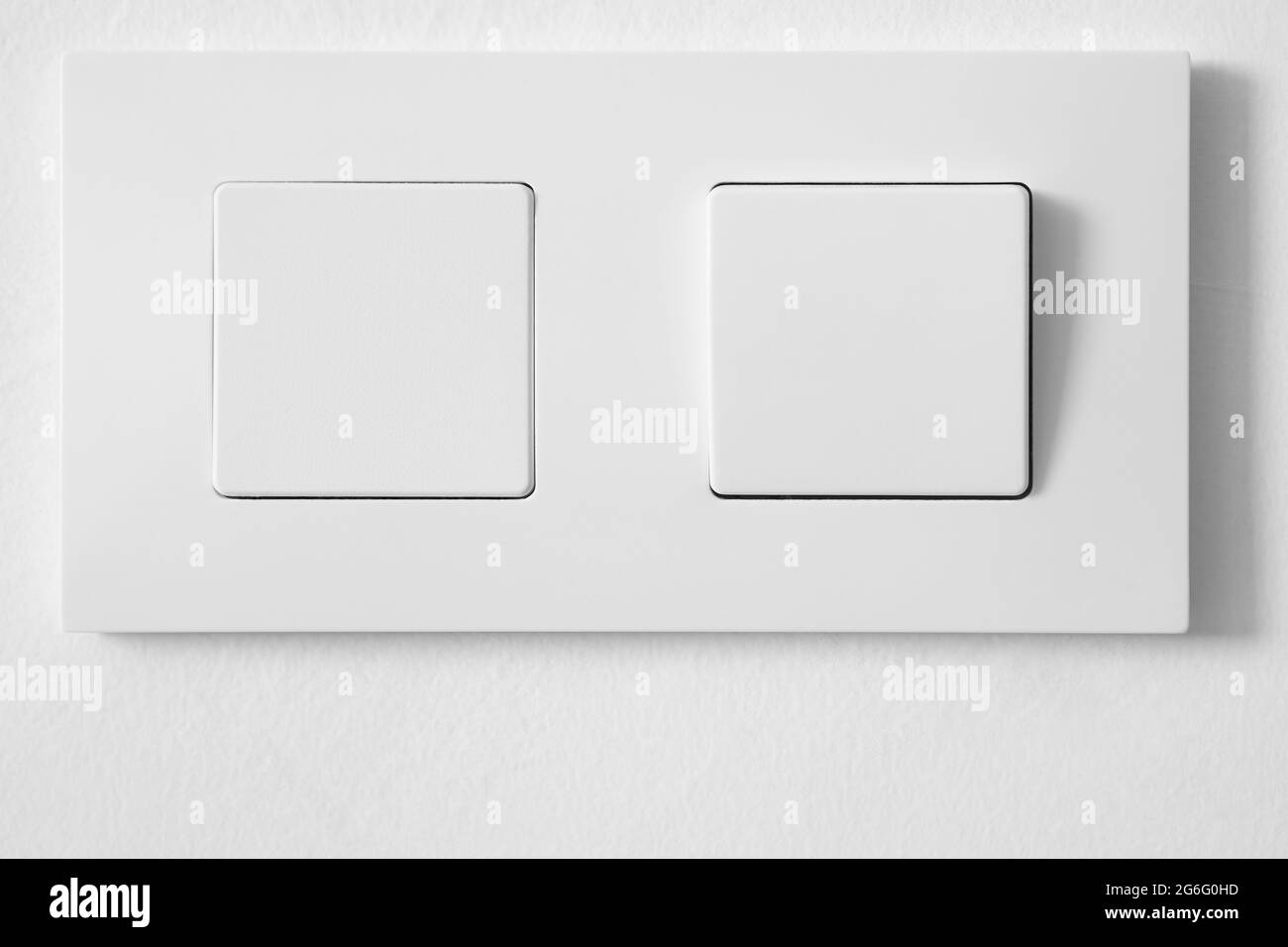 White light switch over a white textured wall. Home equipment Stock ...