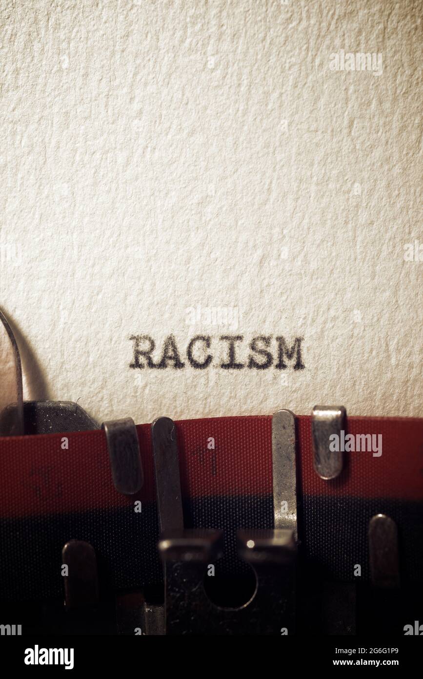 The word racism written with a typewriter Stock Photo - Alamy