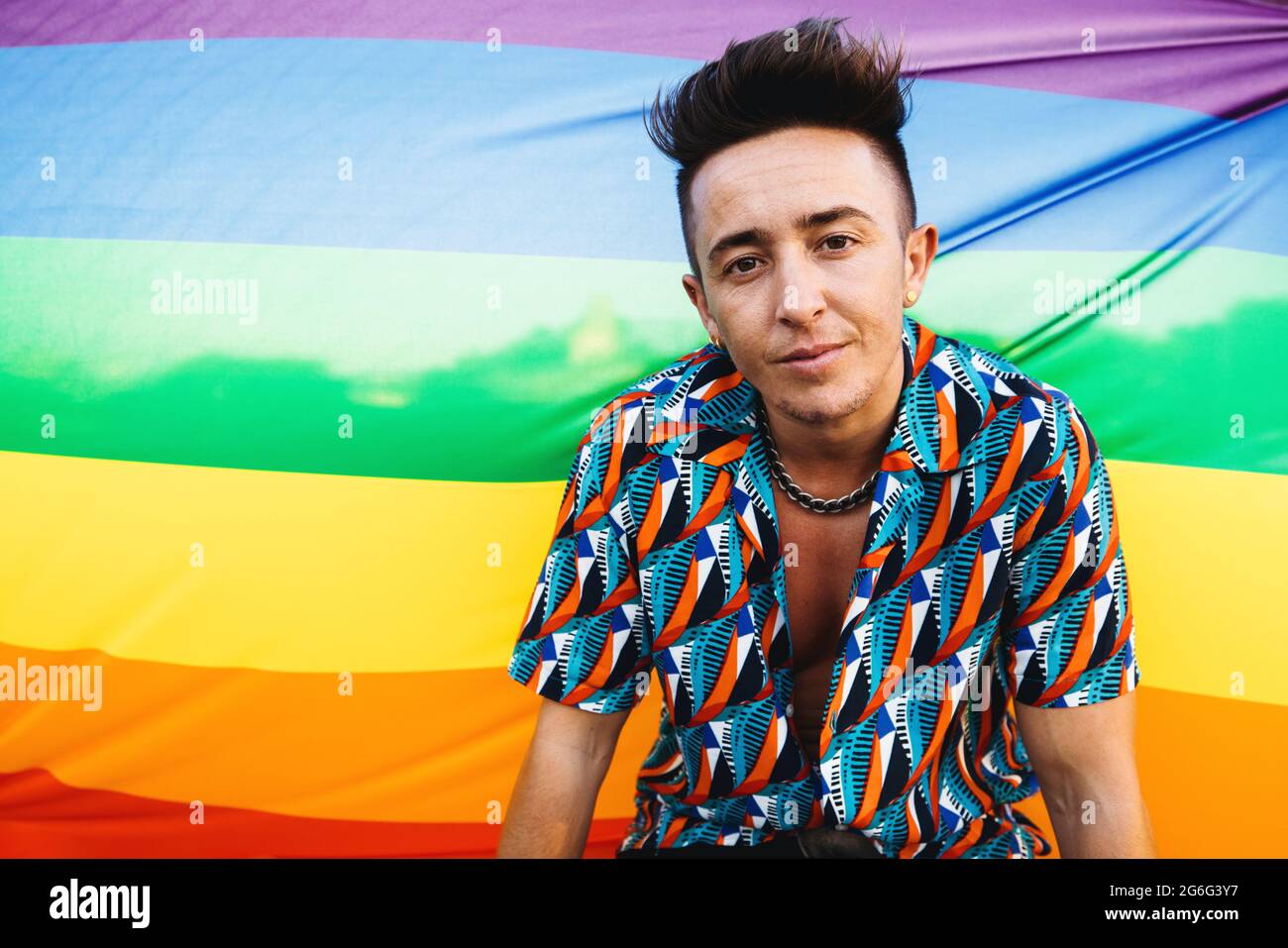 Transman embracing his gender identity. Young transgender man looking ...