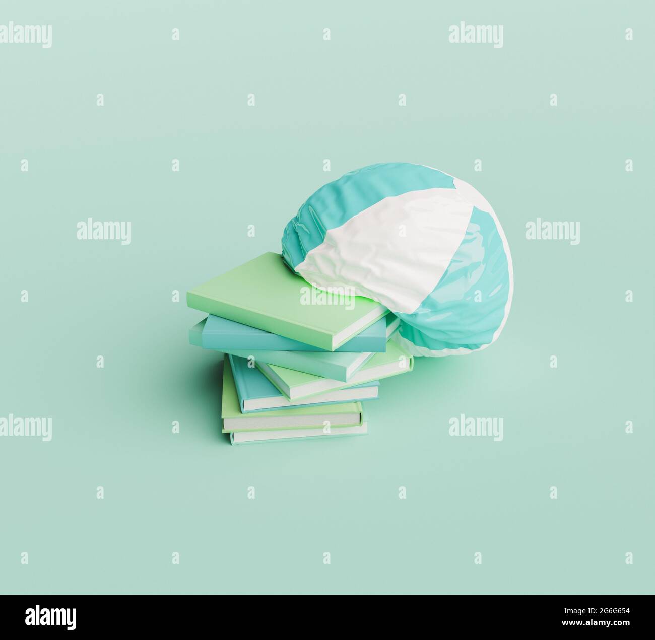 deflated beach ball on a pile of books. minimal scene. concept of end ...